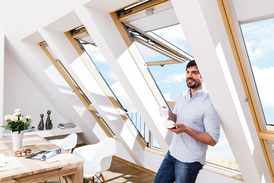 Innovative, large roof window in which the open sashes create a balcony ...