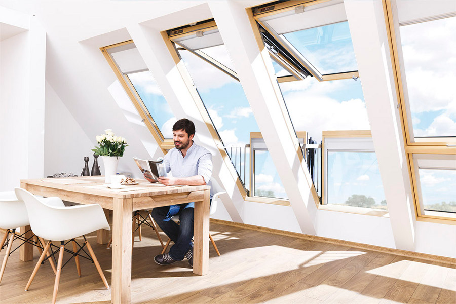 Innovative, large roof window in which the open sashes create a balcony ...