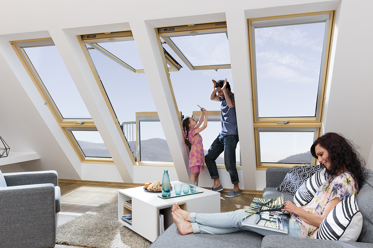 Innovative, large roof window in which the open sashes create a balcony ...