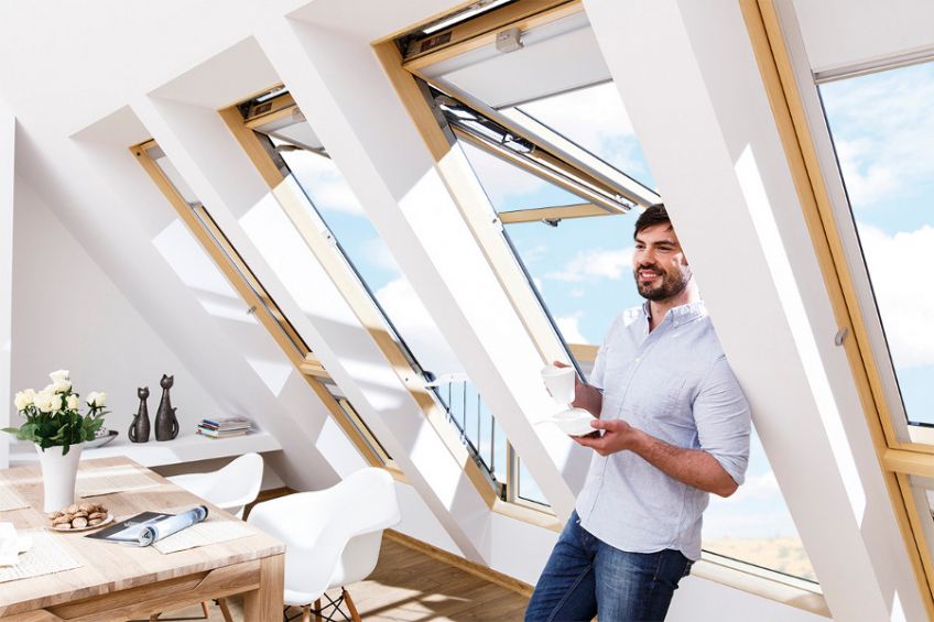 Innovative, large roof window in which the open sashes create a balcony ...