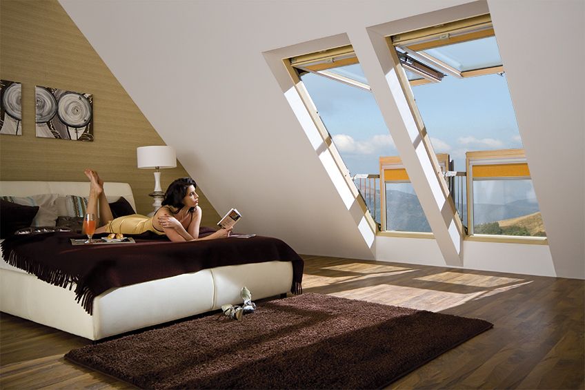 Innovative, large roof window in which the open sashes create a balcony ...